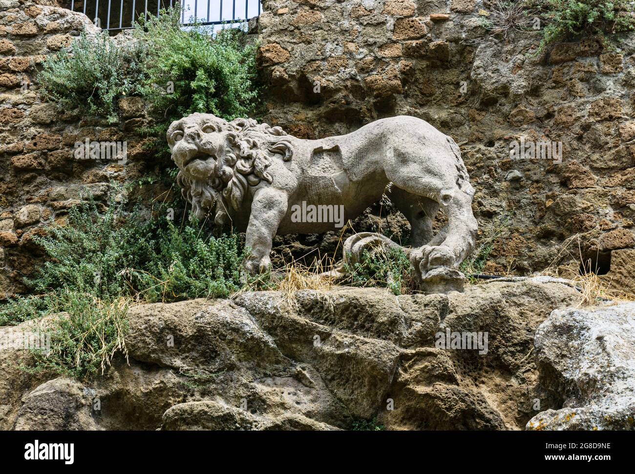 Statue of a lion by Gian Lorenzo Bernini in Monterano Stock Photo - Alamy