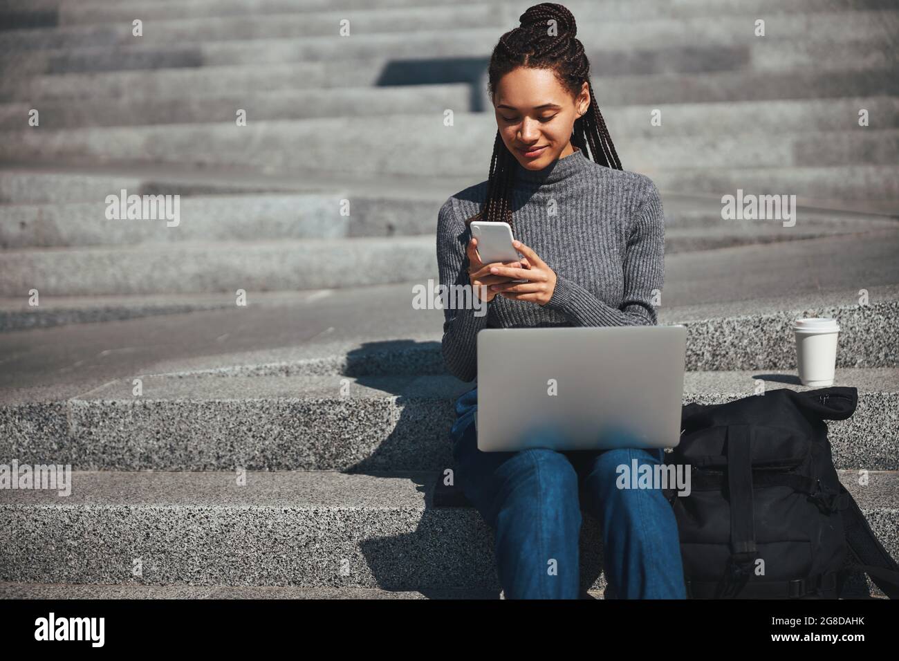 Woman reading text message outside hi-res stock photography and images ...