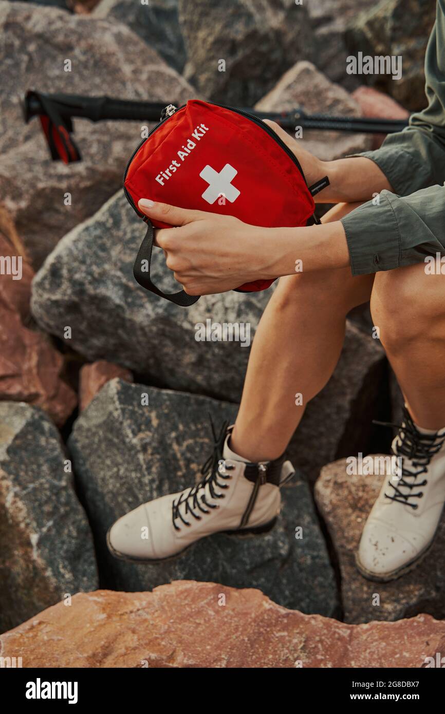 Person showing first aid kit to camera Stock Photo - Alamy