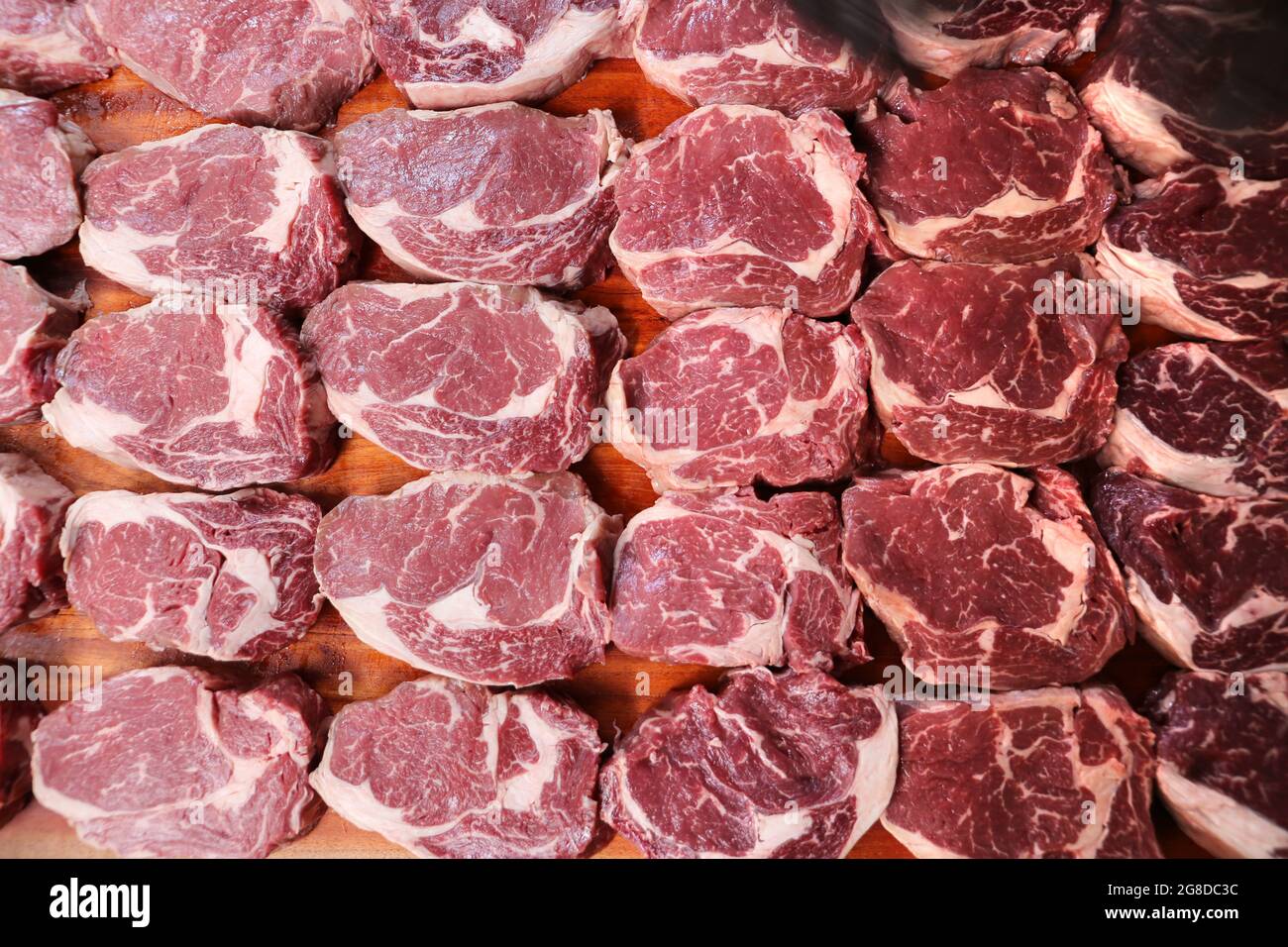 many Ancho or Ribeye steak on a wooden background for a Brazilian ...