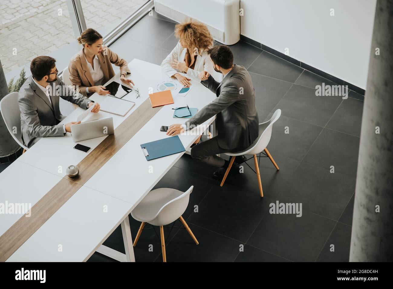 Overhead view at group of multiethnic business people working together ...