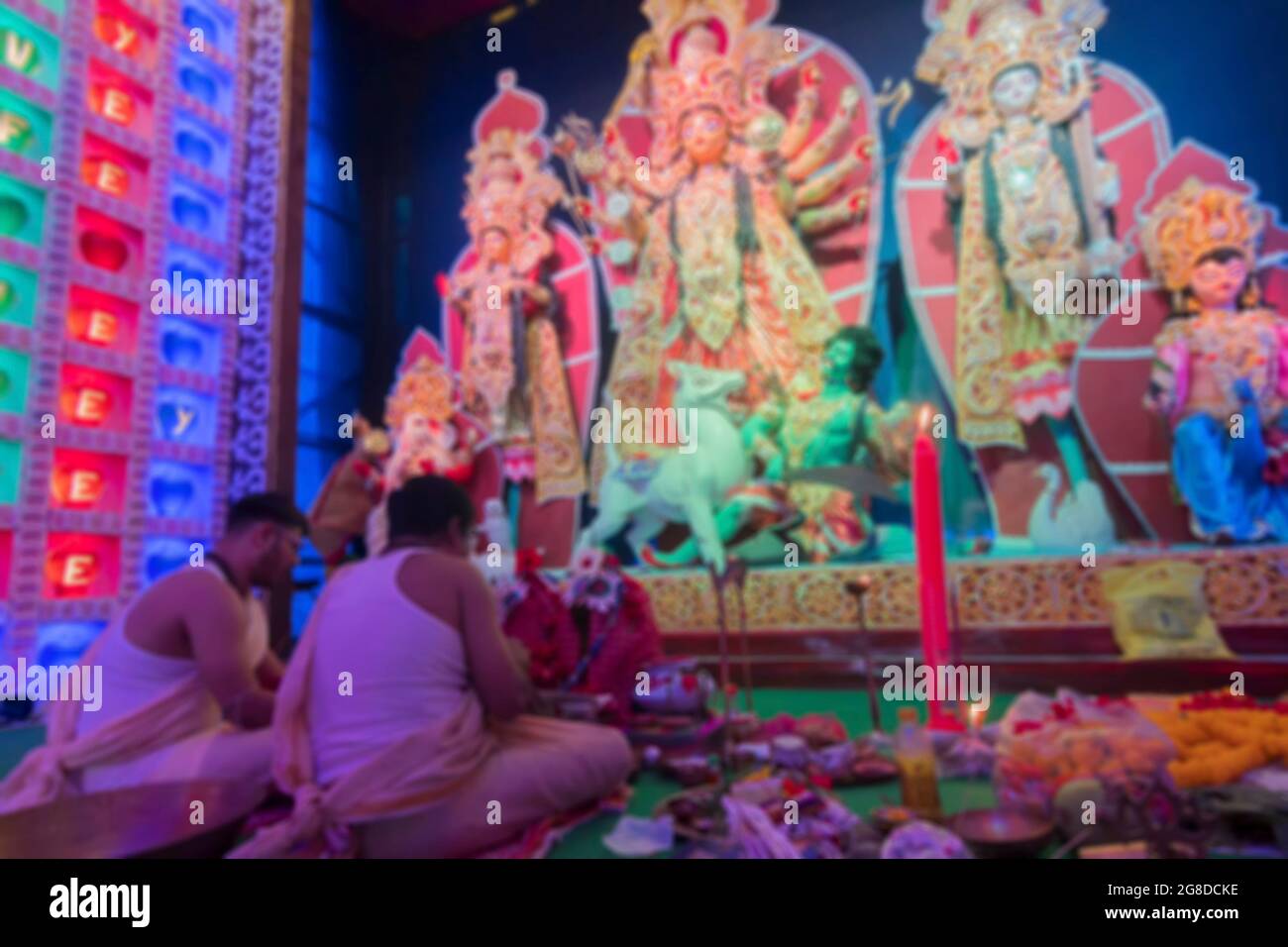 Blurred image of Hindu Bengali purohits chanting Sanskrit shlokas in ...