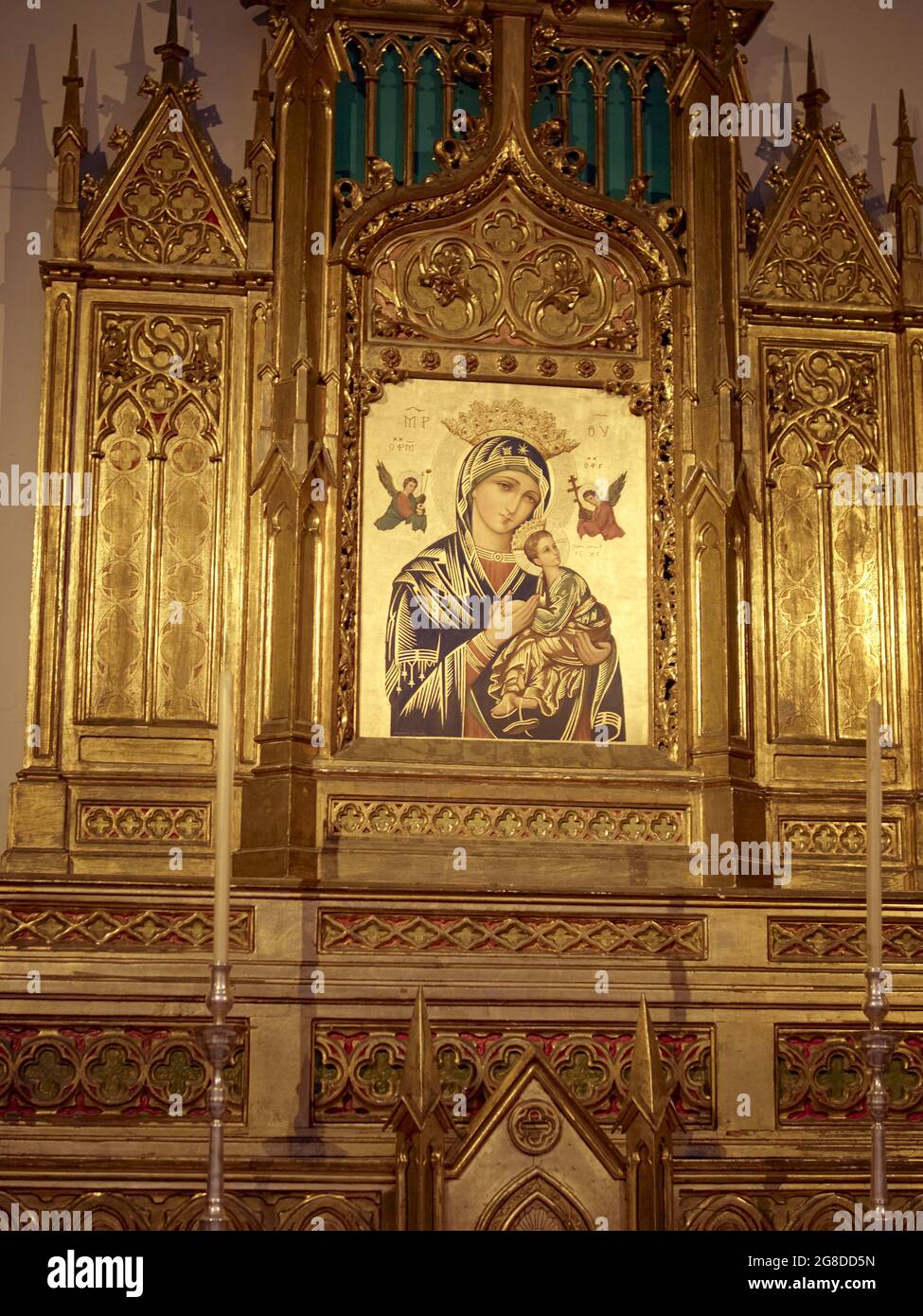 Vertical shot of a beautiful detailed gold wall in a church Stock Photo ...