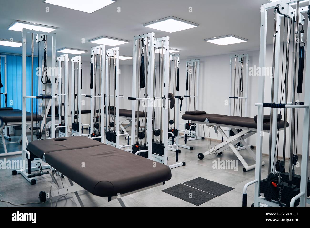 Close up massage bed in recovery center. Interior of physical therapy ...