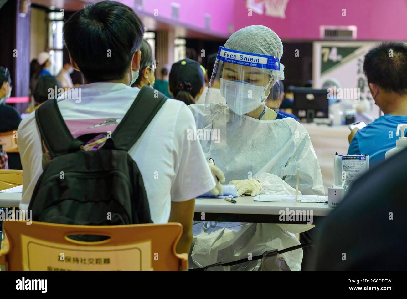 A medical worker wearing a personal protective equipment suit (PPE ...