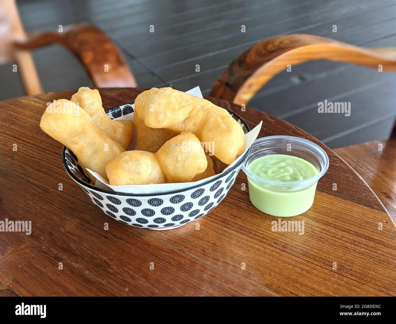 Crispy Flour with Custard in a restaurant Stock Photo - Alamy
