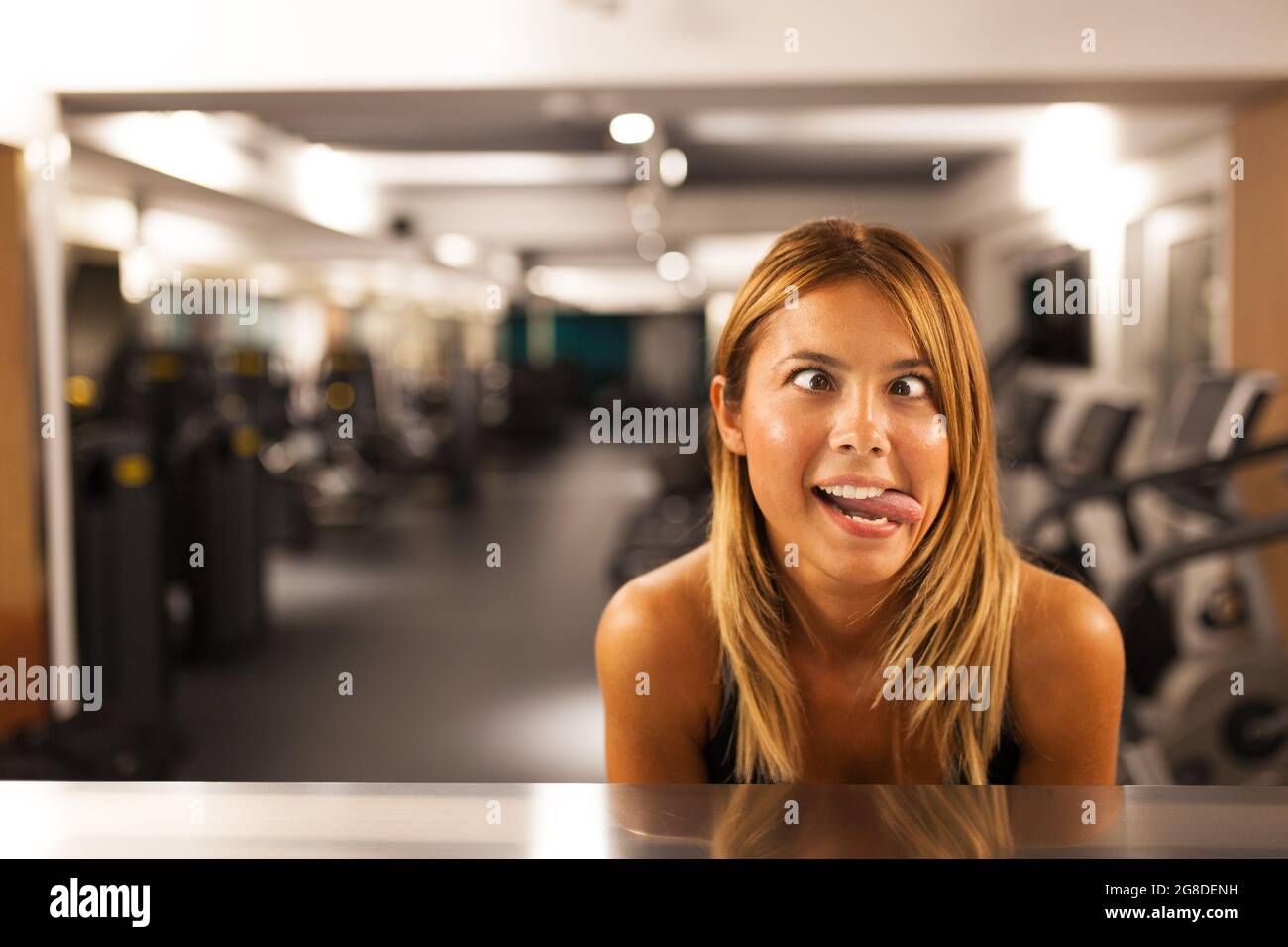 girl with clumsy face expression preparing for fitness work out Stock ...