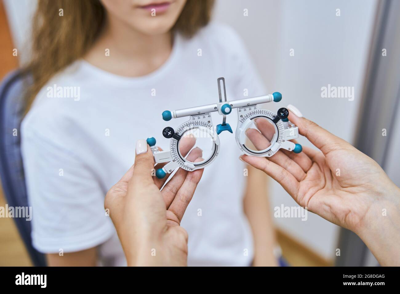 Female doctor giving optical trial lens frame to patient Stock Photo ...