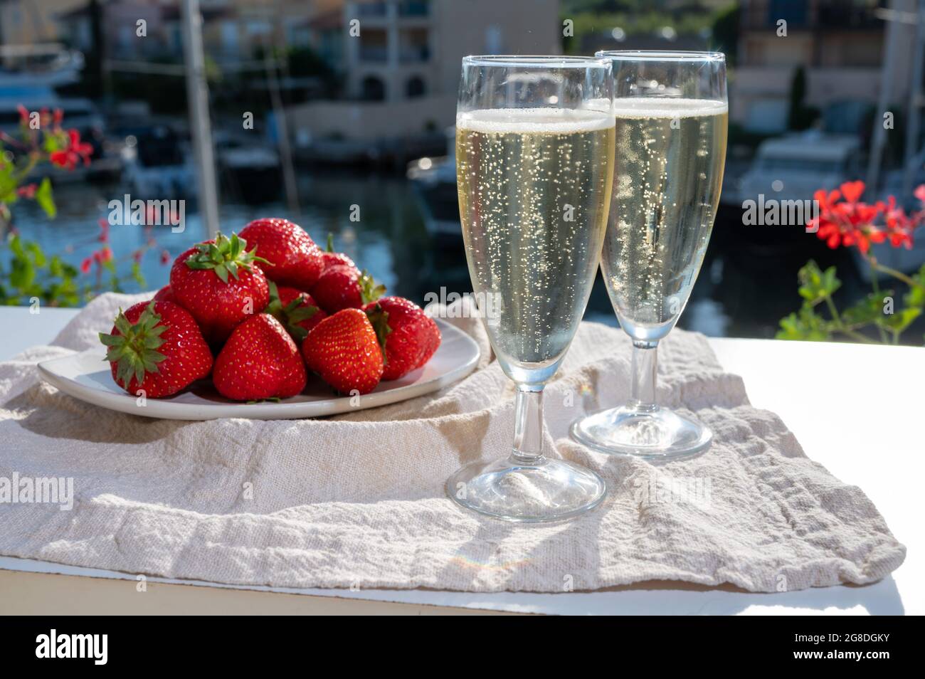 Summer party, pouring of French brut champagne sparkling wine in ...