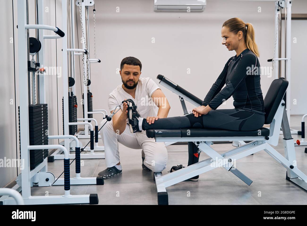 Rehabilitation foot therapy. Physiotherapist stretching woman barefoot ...