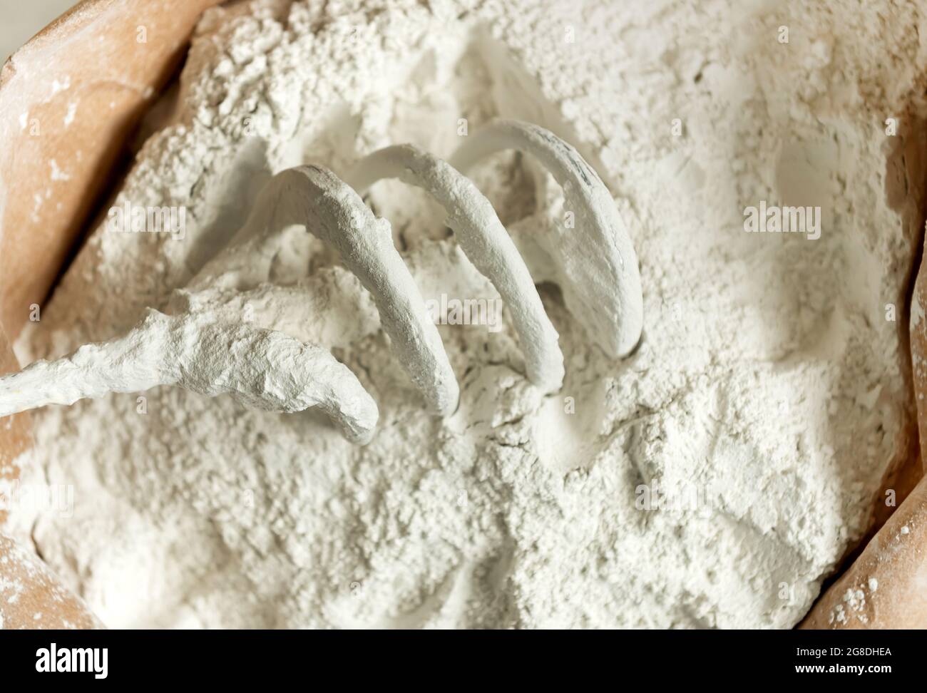 Putty. A spatula. Hand-held mixer . A bag with putty and a mixer for ...