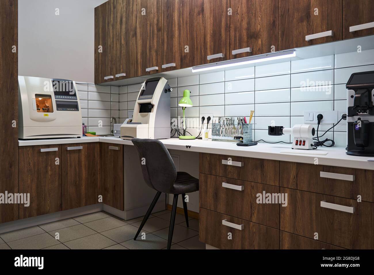 Optician workplace with modern optical equipment and tools Stock Photo ...