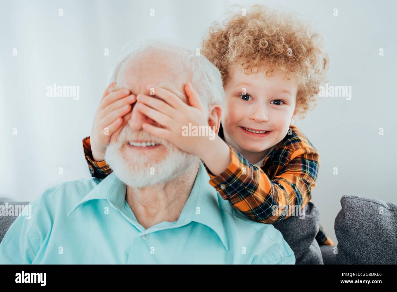 Grandparents and grandson playing at home - Family at home, grandfather ...