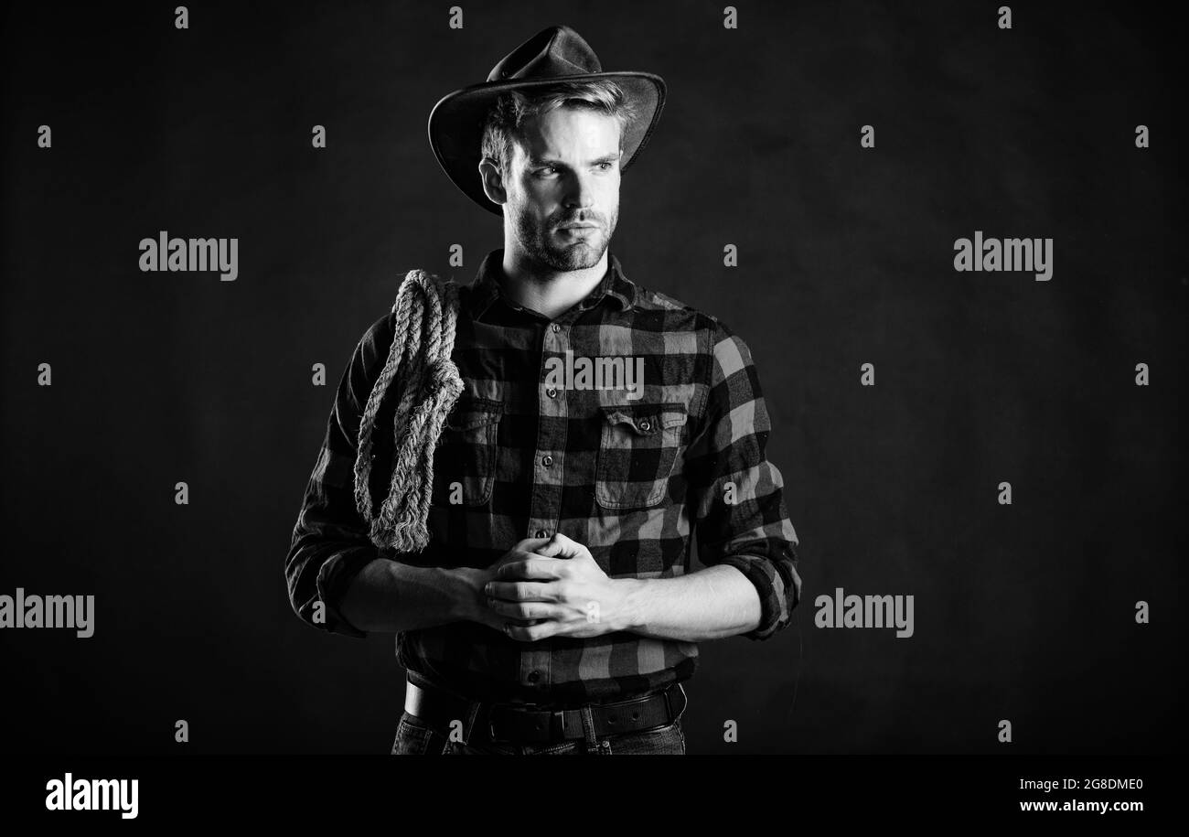 Lasso used rodeos competitive events. Man wearing hat hold rope. Lasso ...