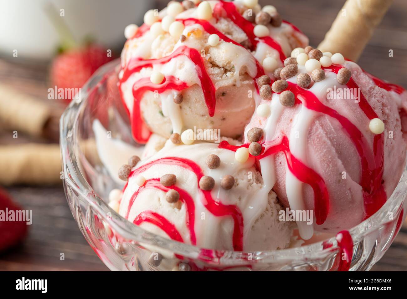 strawberry, banana and cream Roma ice cream in a glass bowl with red ...