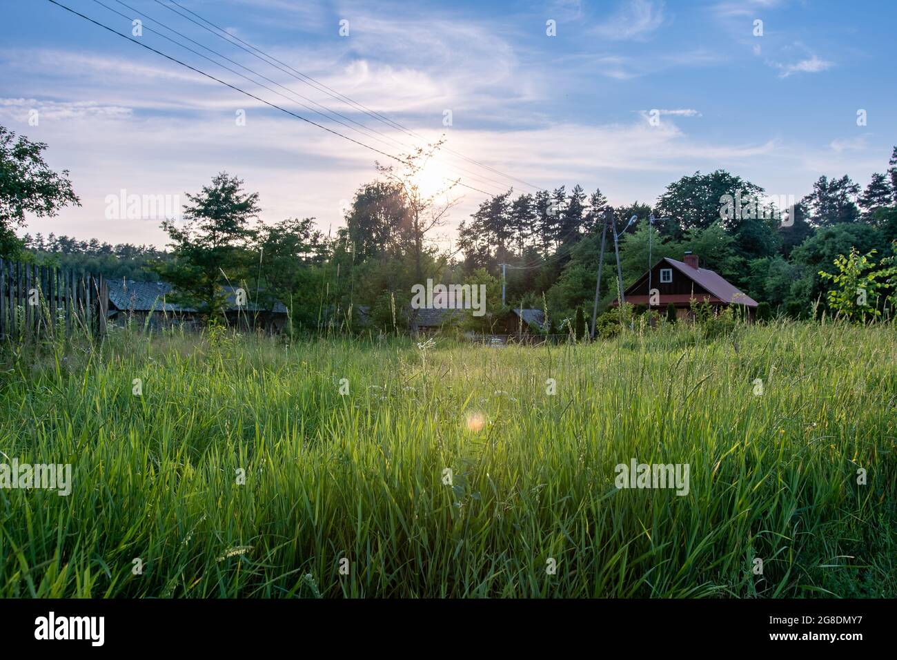 Beautiful, traditional, polish village at the sunset. Old, wooden ...
