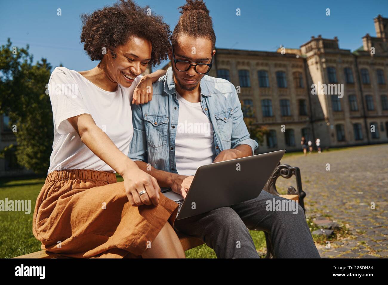 Browsing the Internet together while having free time Stock Photo - Alamy
