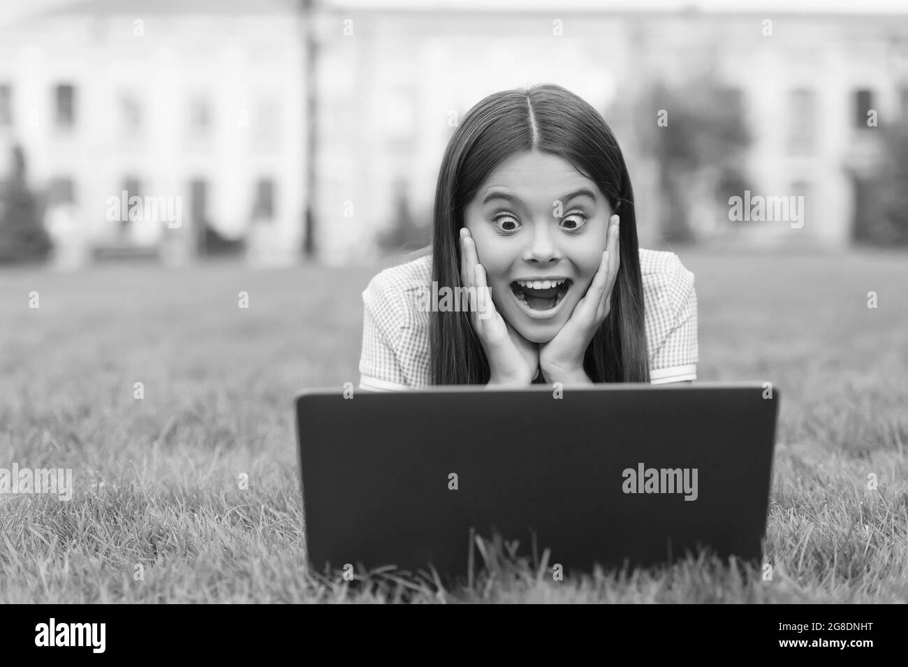 happy surprised child looking at computer screen and feel happiness ...