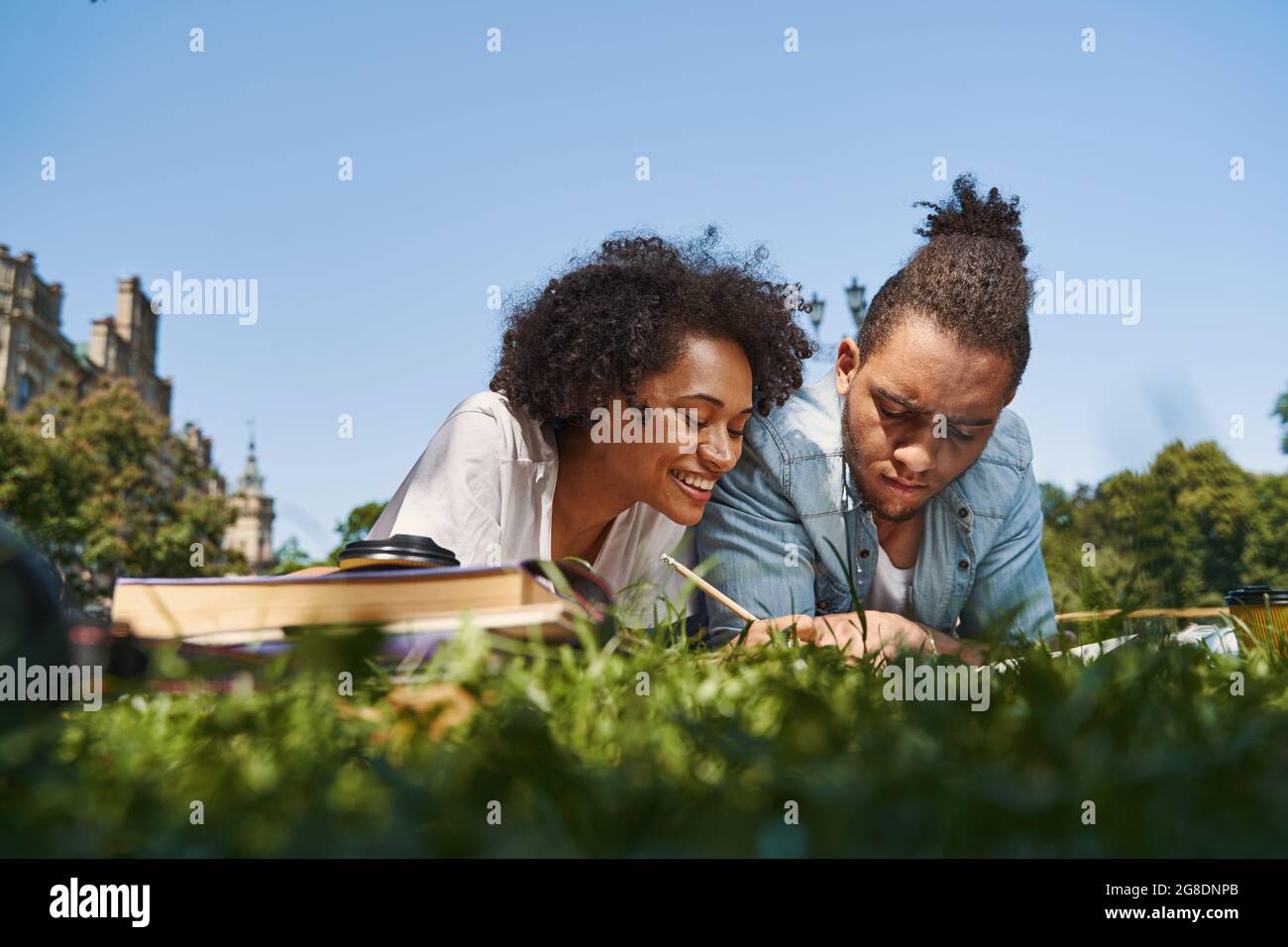 Couple of students working on their project together Stock Photo - Alamy