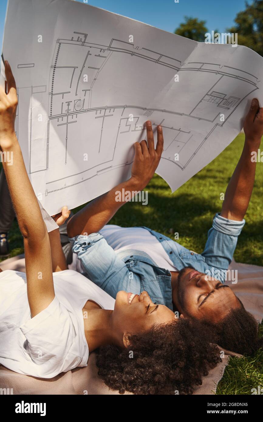 Gladsome student feeling excited about their new project Stock Photo ...