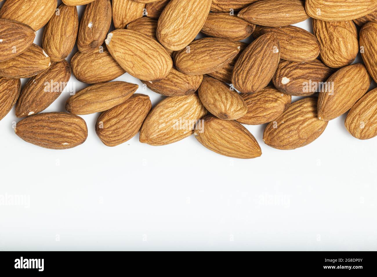 Top view of delicious almonds on an isolated white background for copy ...