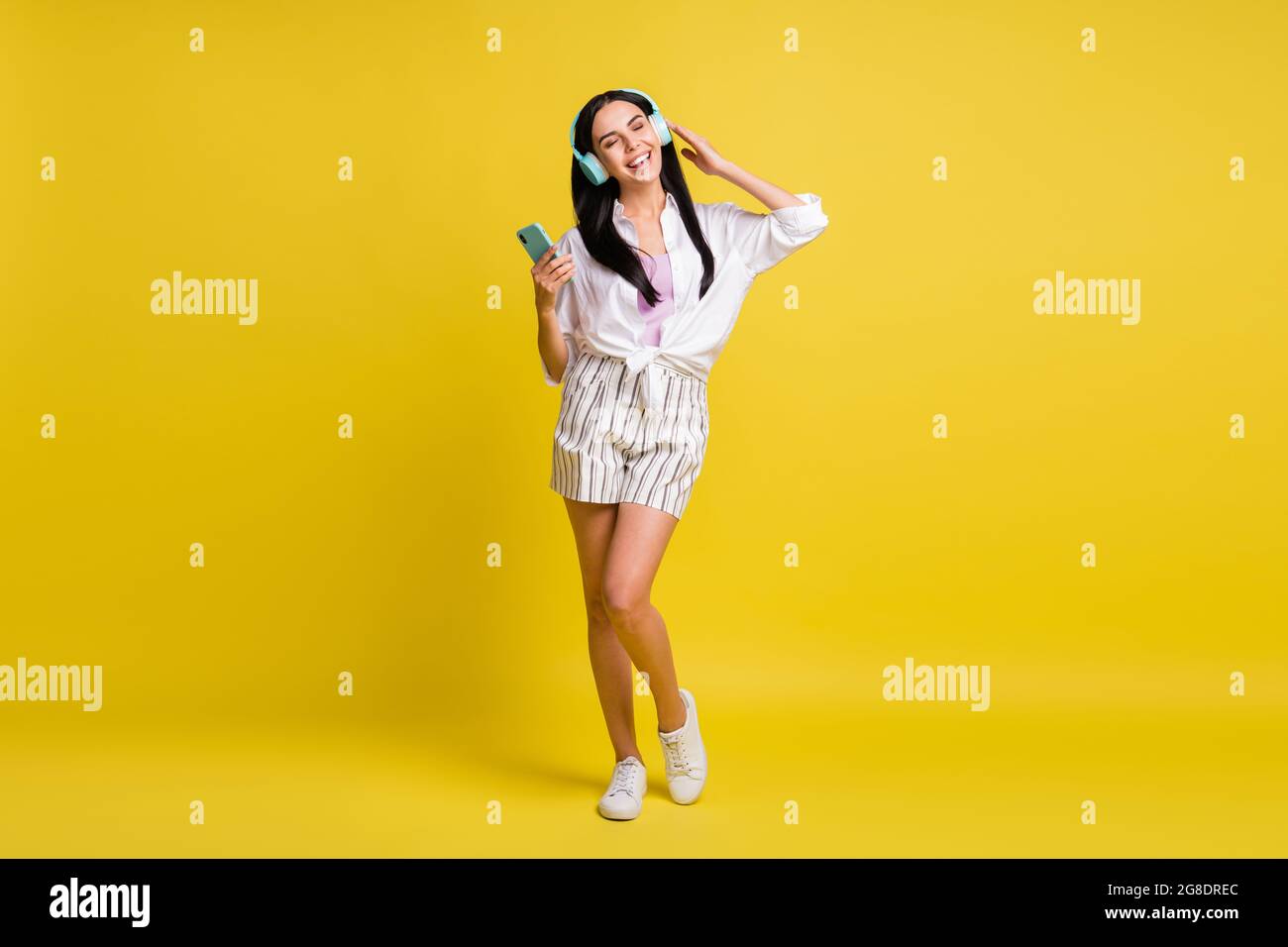 Full size photo of young charming positive girl listen music in ...