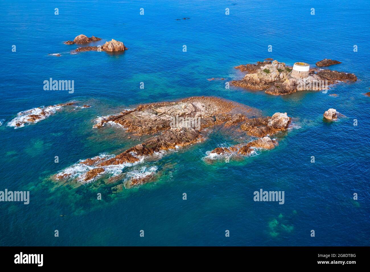 Aerial drone image of Icho Tower at high tide in the sunshine. Jersey ...