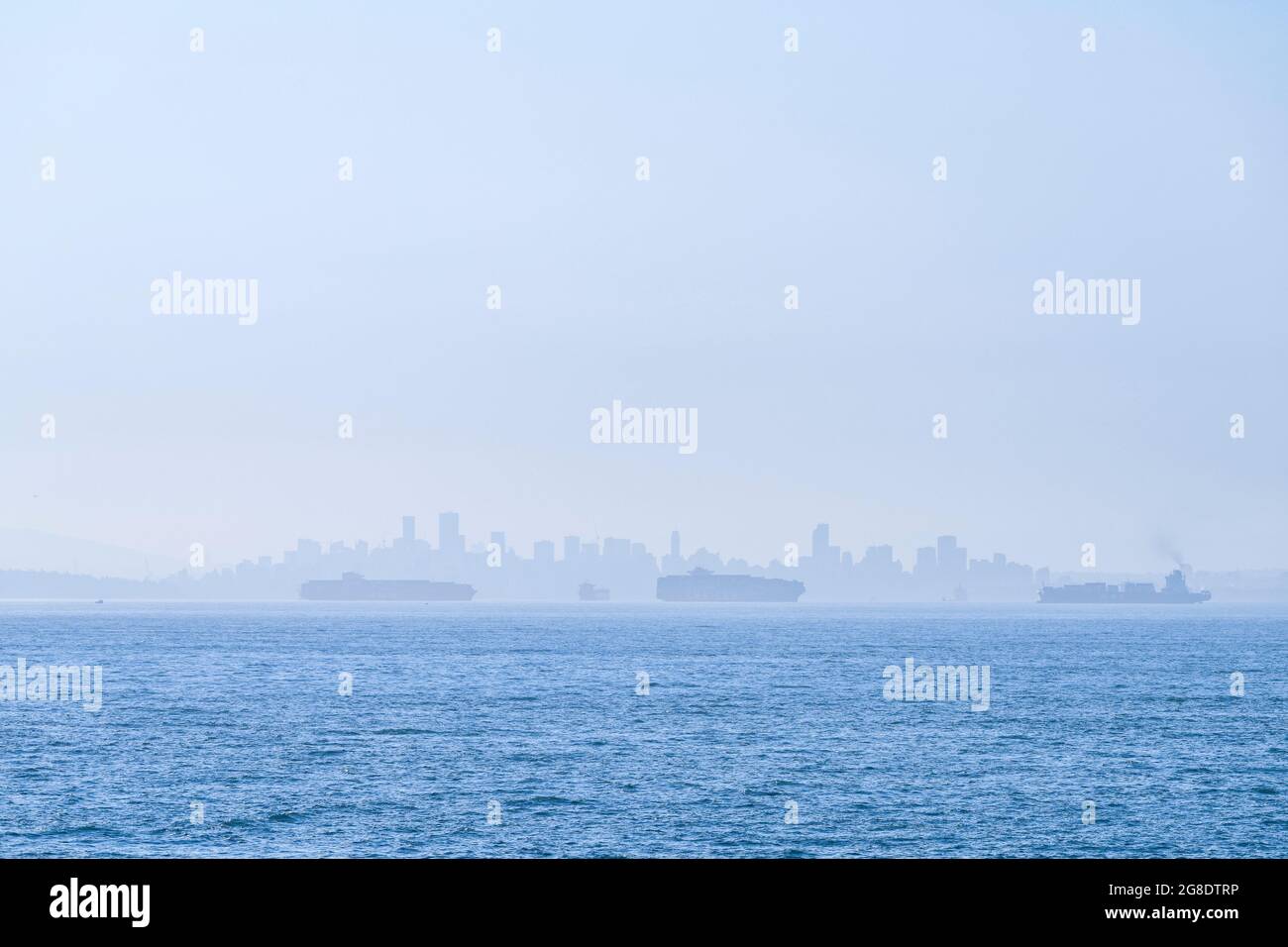 Vancouver skyline through Summer smog and haze, English Bay, British ...