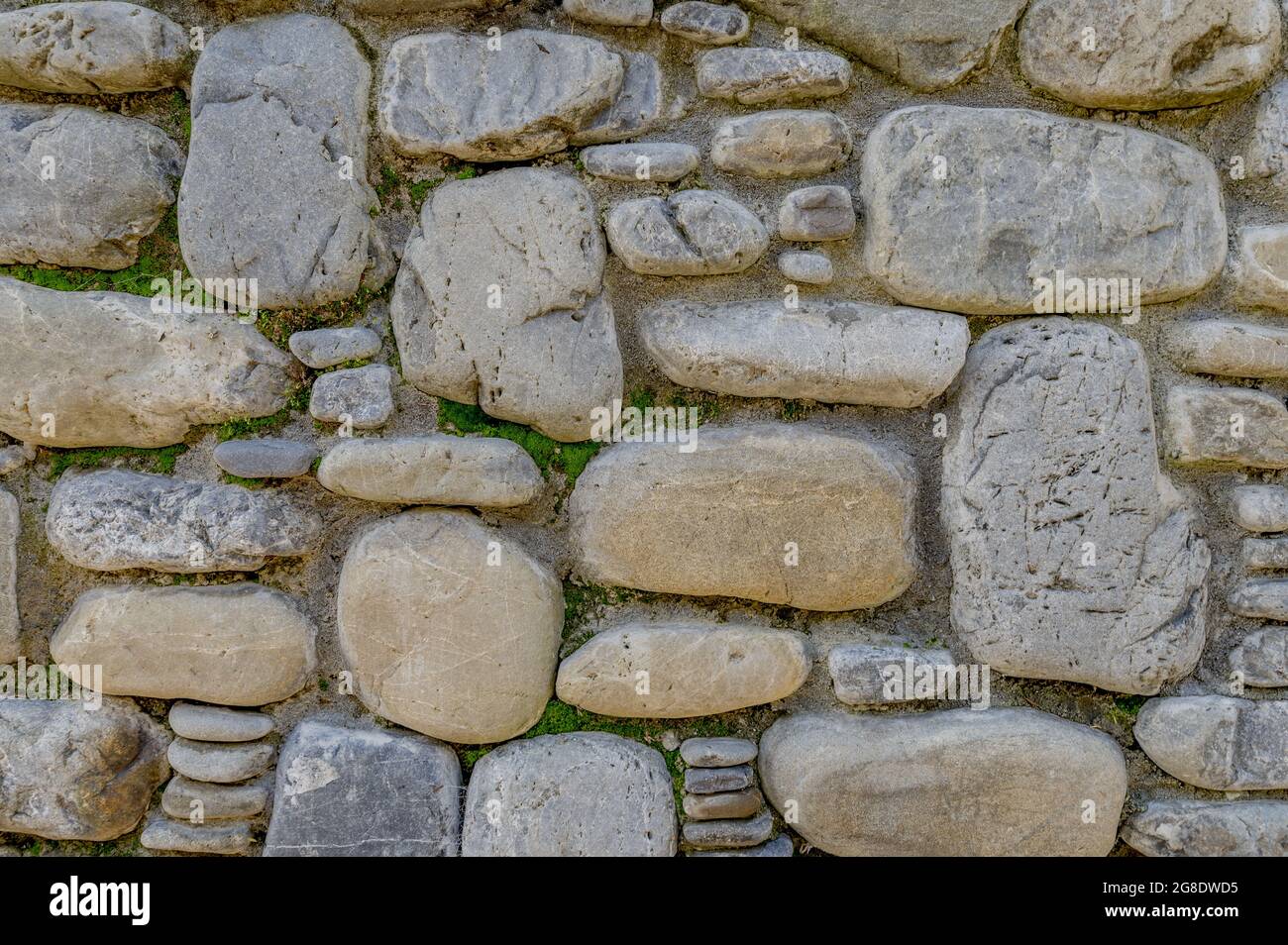 Closeup of a hand-built rock wall for background Stock Photo - Alamy