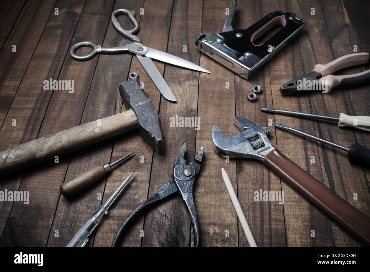 Set of different tools on vintage wood table background Stock Photo - Alamy