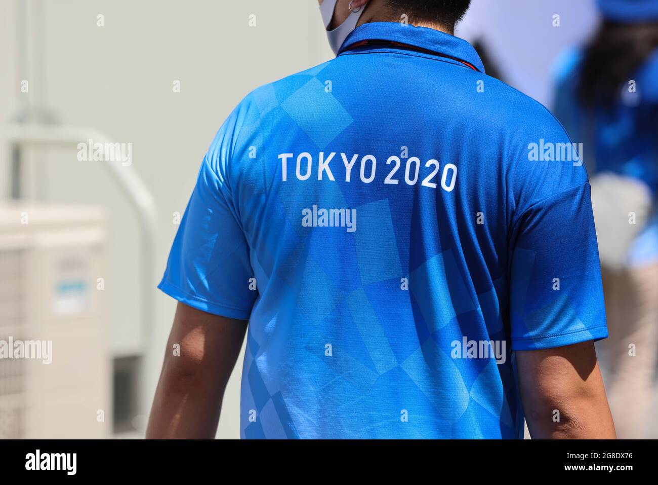 A volunteer seen at a body temperature measurement check point near the ...