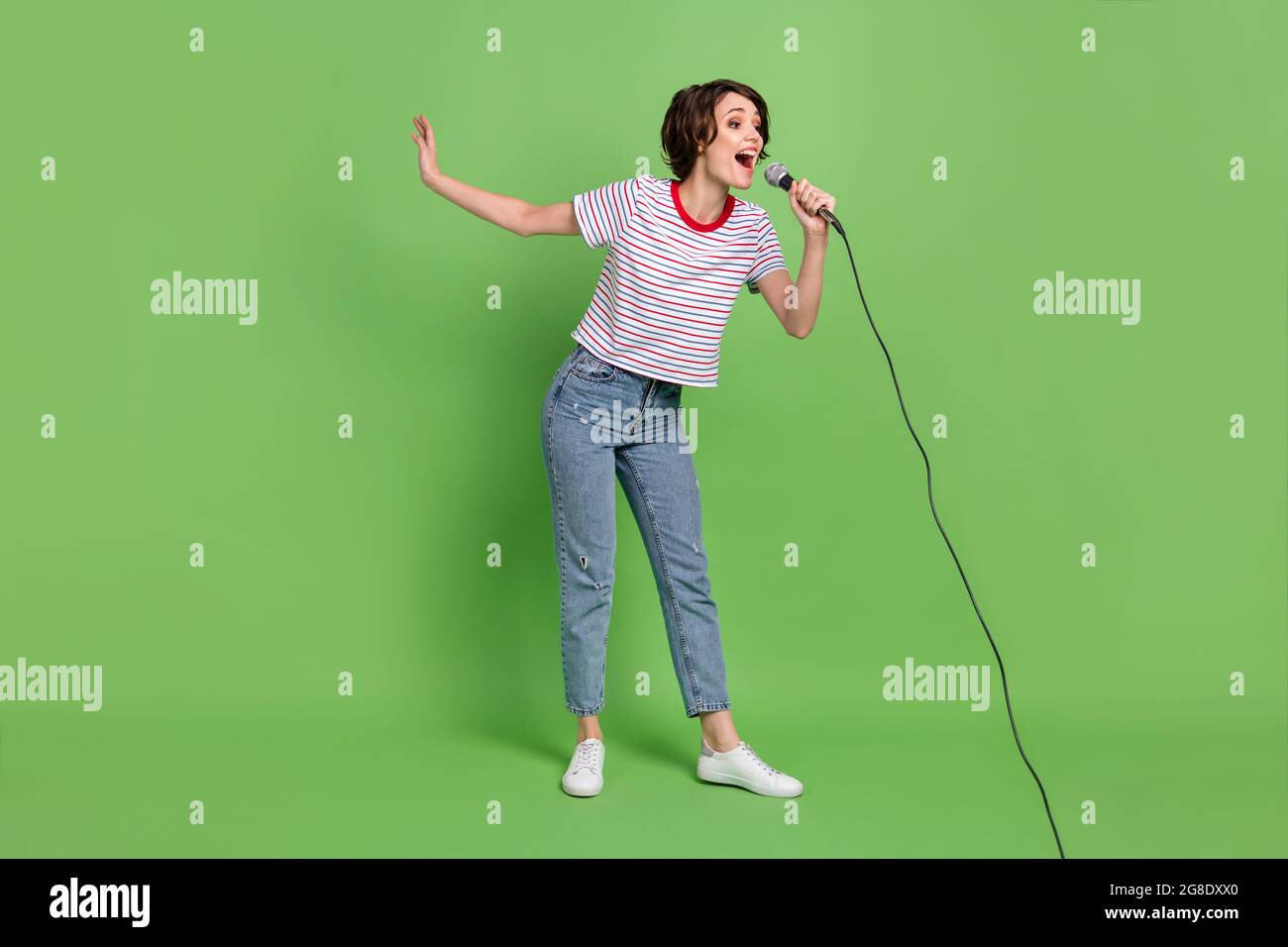 Full length body size view of pretty talented cheerful girl singing ...
