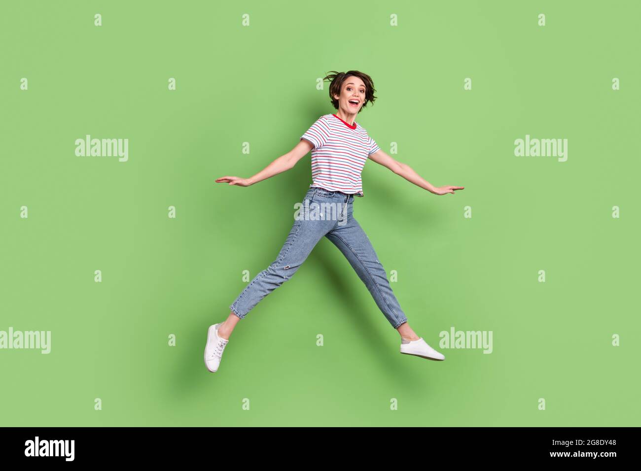 Full length body size view of pretty cheerful funny girl jumping ...