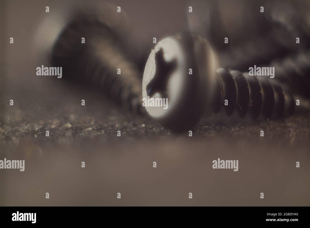 Closeup shot of different screws and bolts on a rough surface Stock ...
