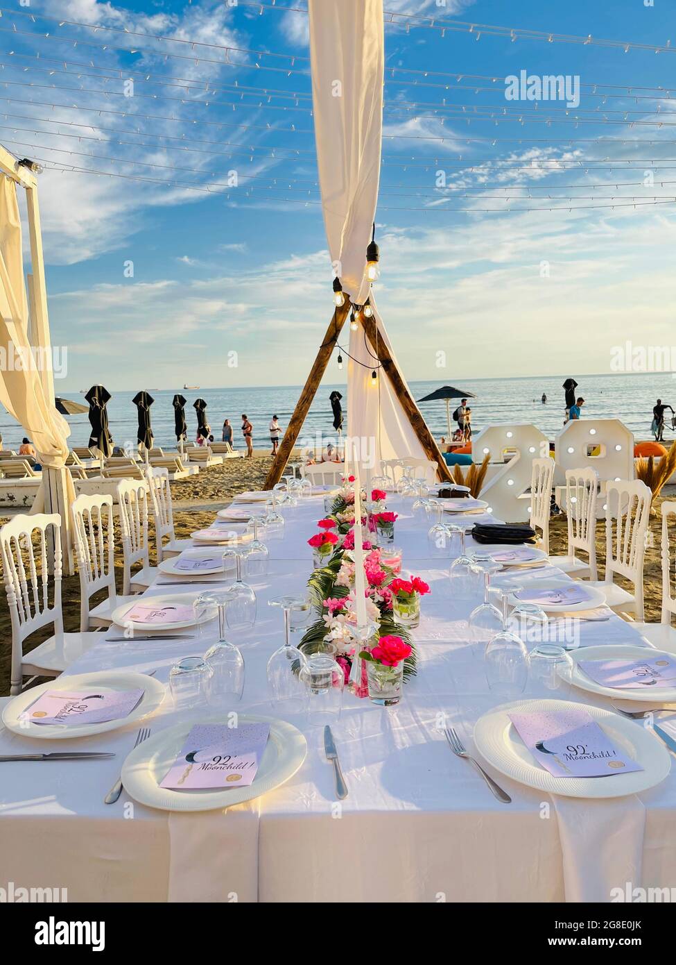 Birthday party decoration of a table with flowers on a sunset Stock ...