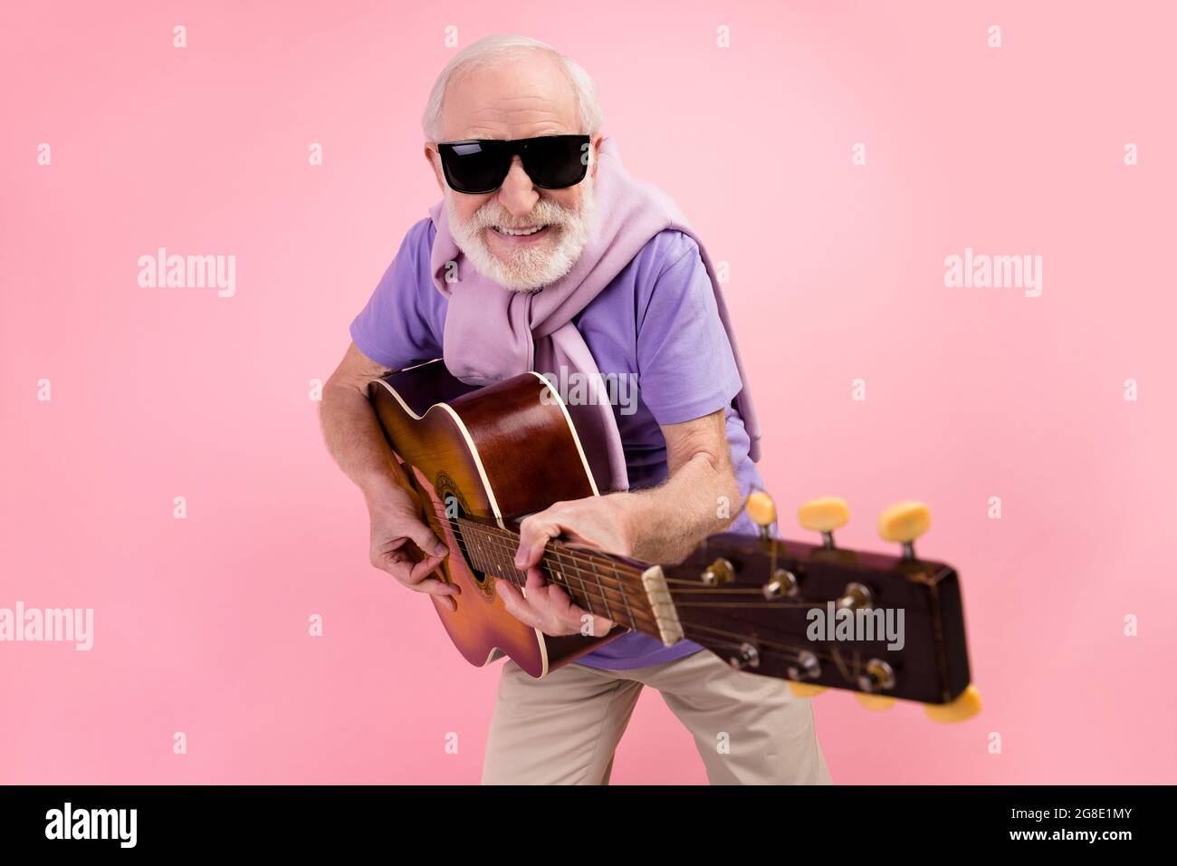 Photo portrait of funky happy grandpa playing guitar in black sunglass ...