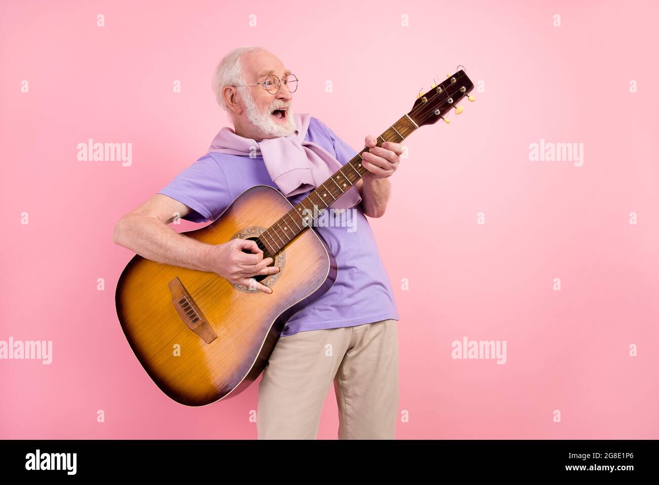 Photo portrait of funky happy grandpa playing guitar smiling like rock ...