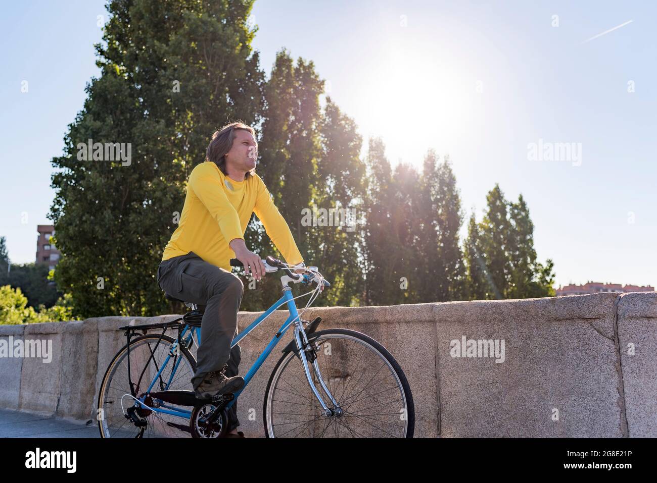 Man riding bicycle to work hi-res stock photography and images - Alamy