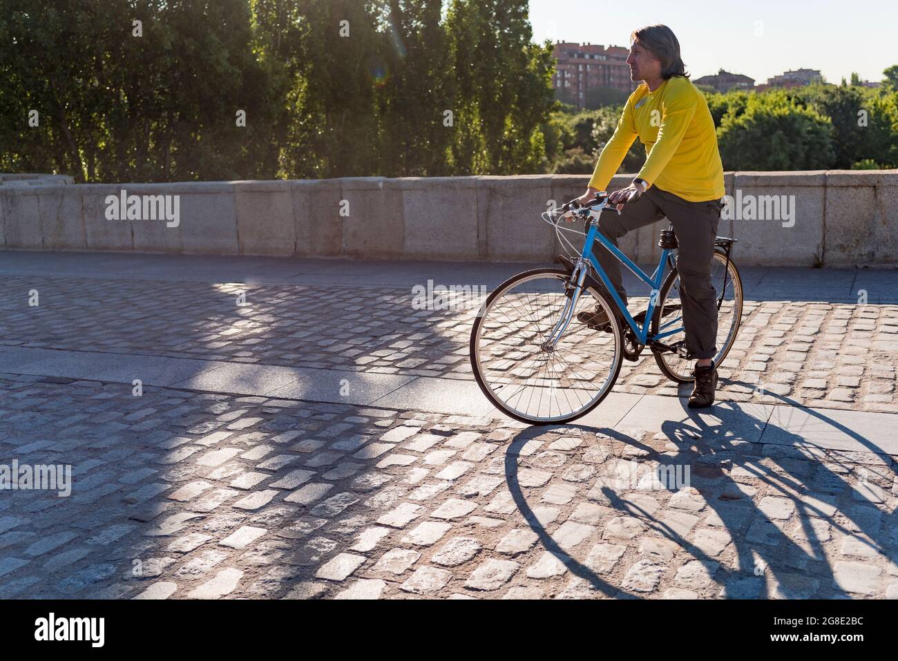 Young man alone riding bicycle hi-res stock photography and images - Alamy