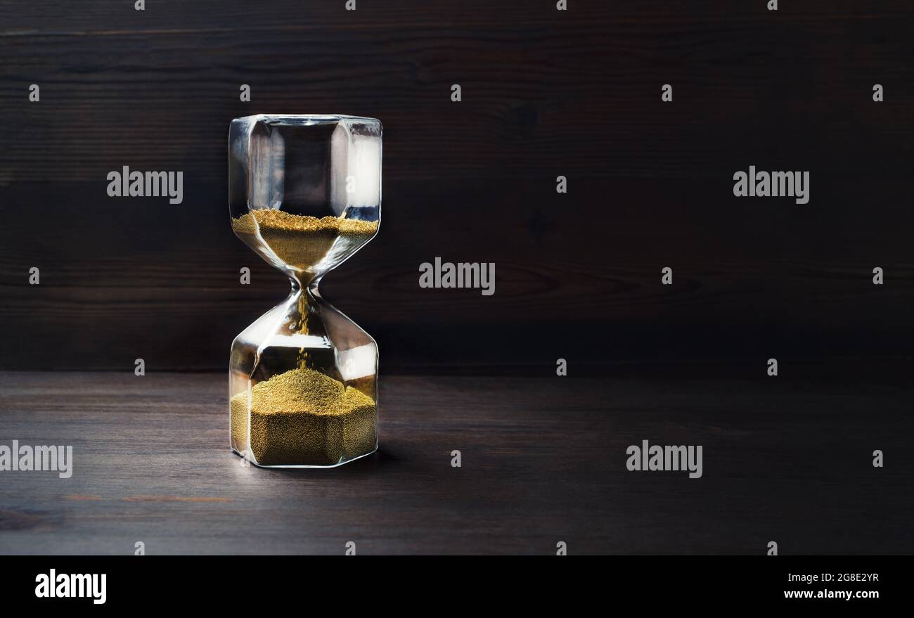 Hourglass on wooden background with copy space. Time Running Out Stock ...
