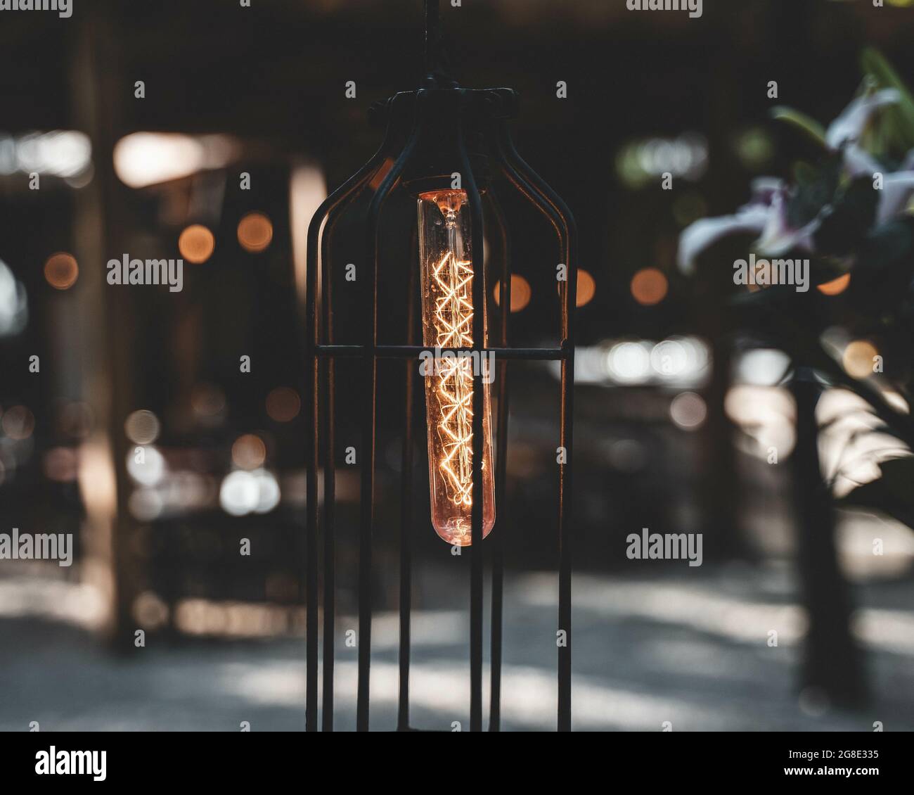 Cool lamp with a long lightbulb with illuminated rods Stock Photo - Alamy