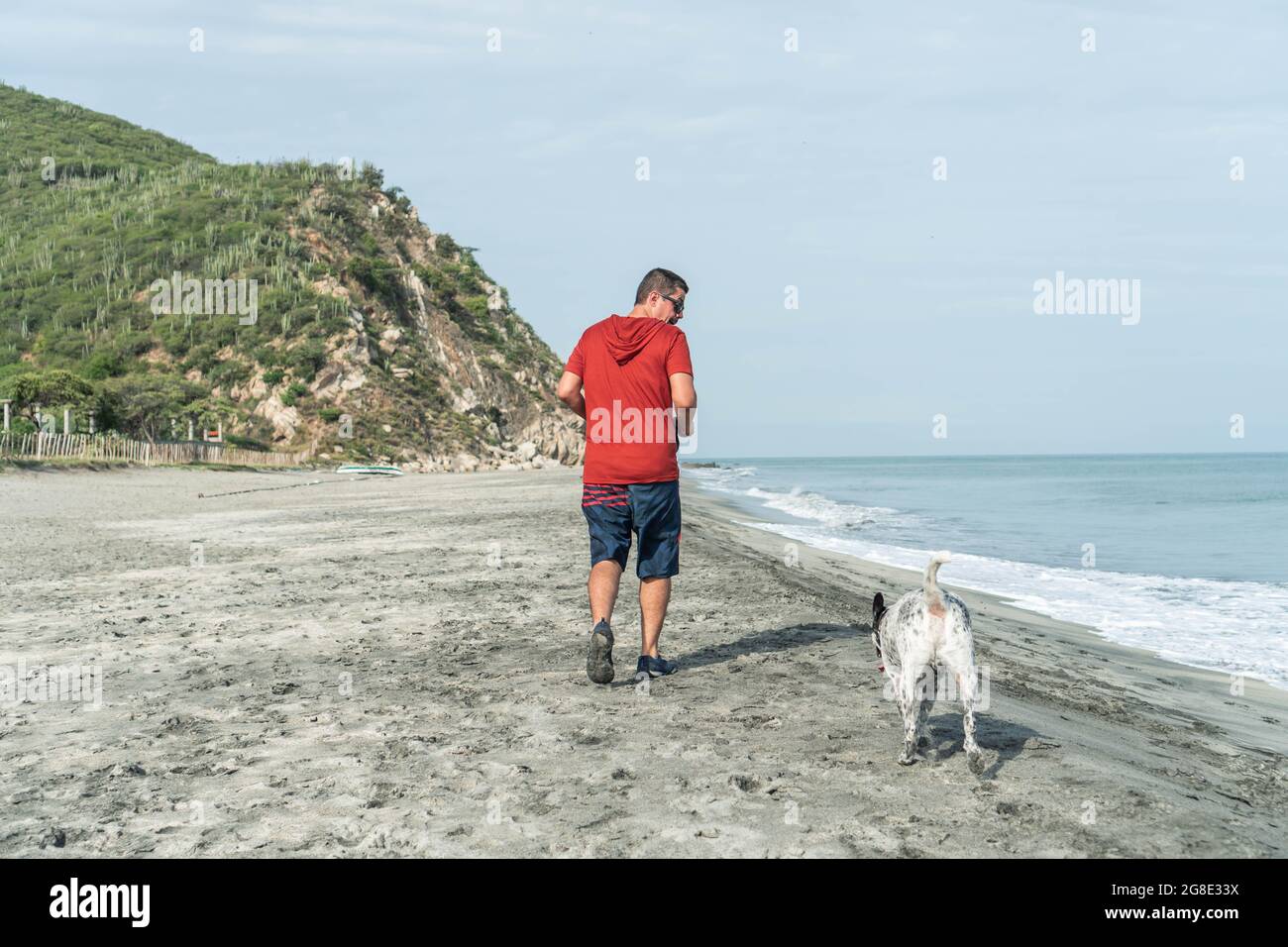 Older Man having fun with his dog on the beach in the morning Stock ...