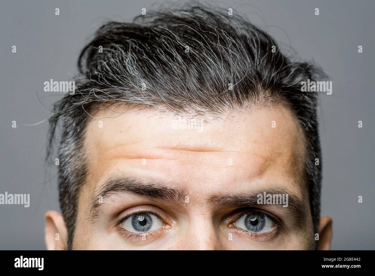 male face with scared eyes Stock Photo - Alamy