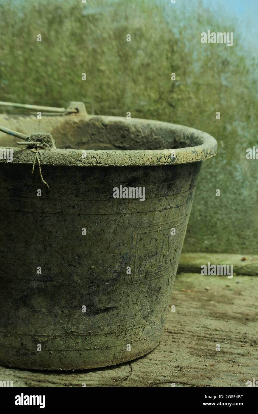 Rusty old bucket in a garden Stock Photo - Alamy