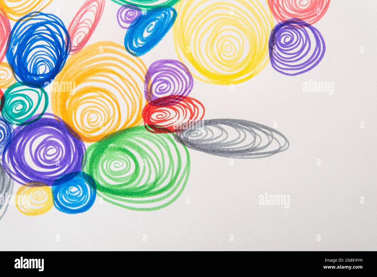 White paper with colorful spiral circle drawings on one side Stock ...