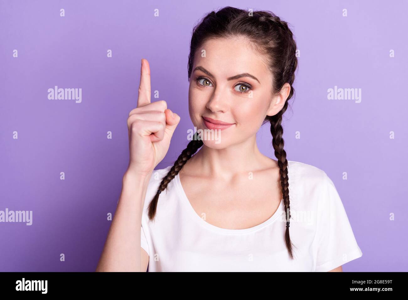 Photo of satisfied smart young girl smile point finger look camera ...