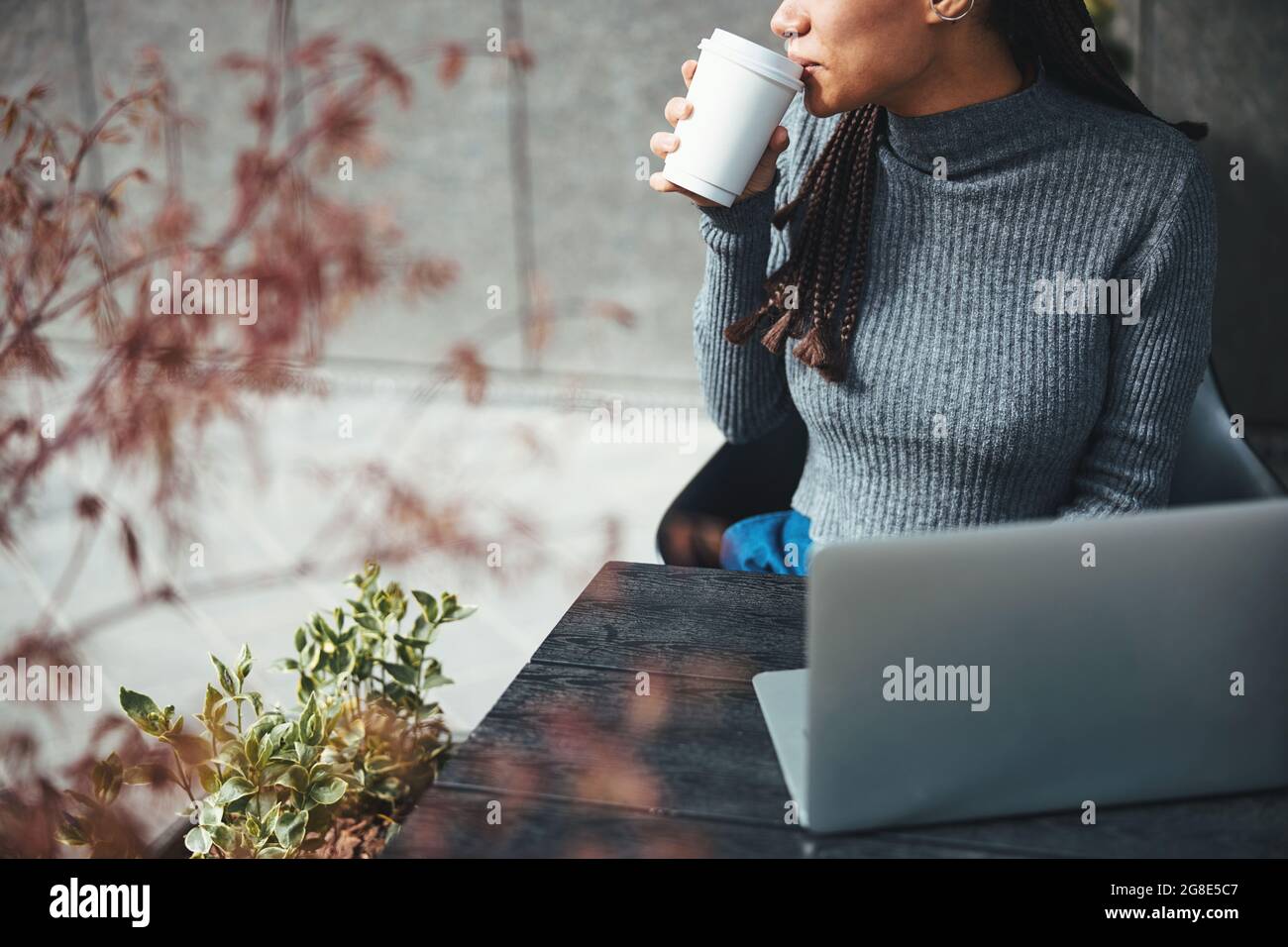 Young woman sips coffee hi-res stock photography and images - Alamy