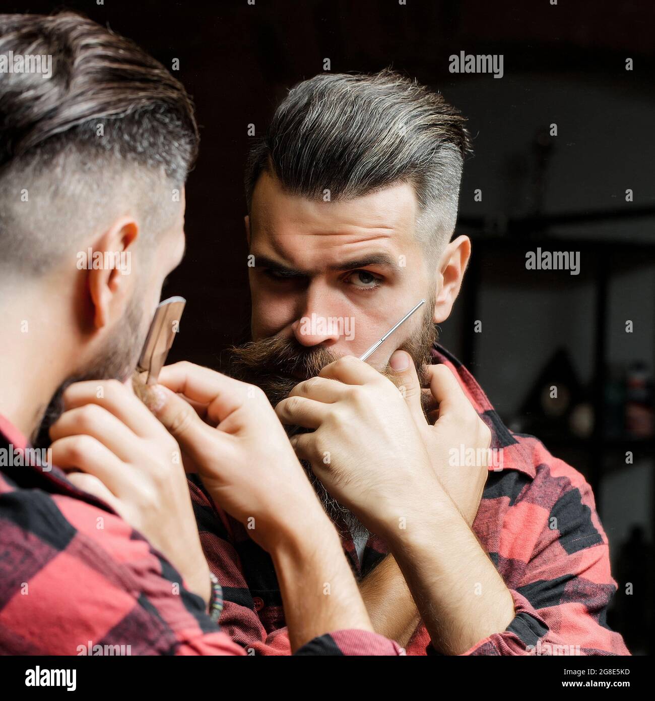 man with razor near mirror Stock Photo - Alamy
