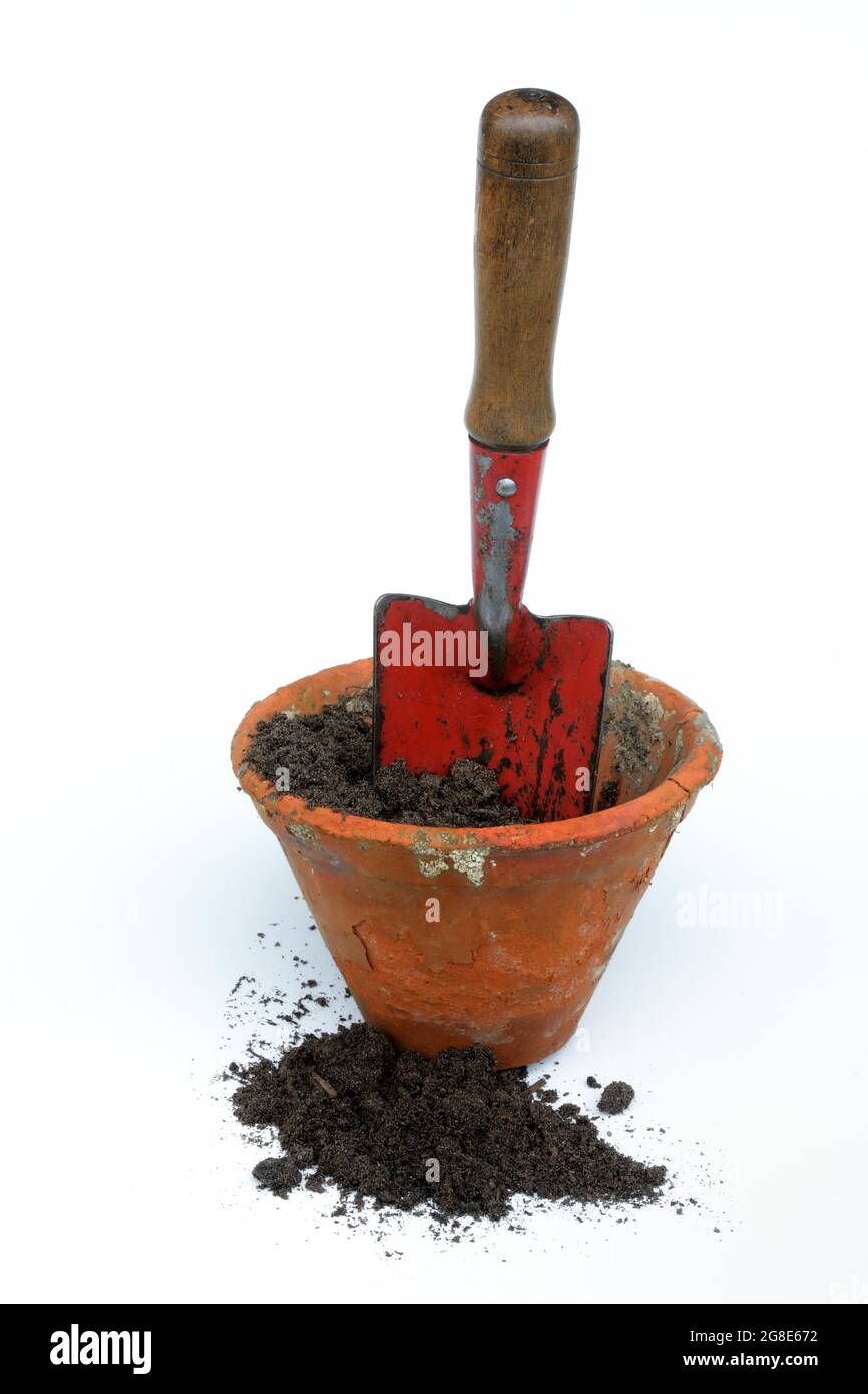 Clay pots and garden shovel, Germany Stock Photo - Alamy