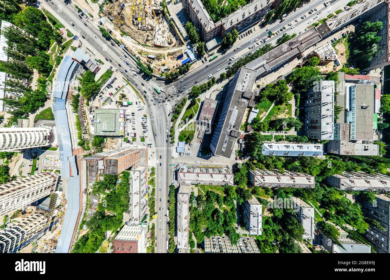 Aerial city view with crossroads and roads, houses, buildings, parks ...